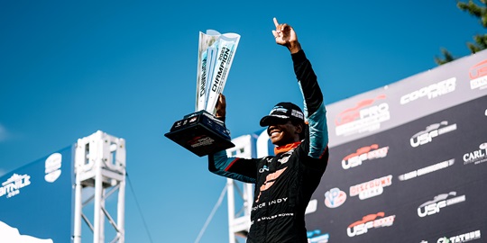 Rowe Makes Racing History, Continues Climb with Title